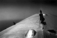 lifephotogallery|repairing the hull of the graf zeppelin during the flight over the atlantic